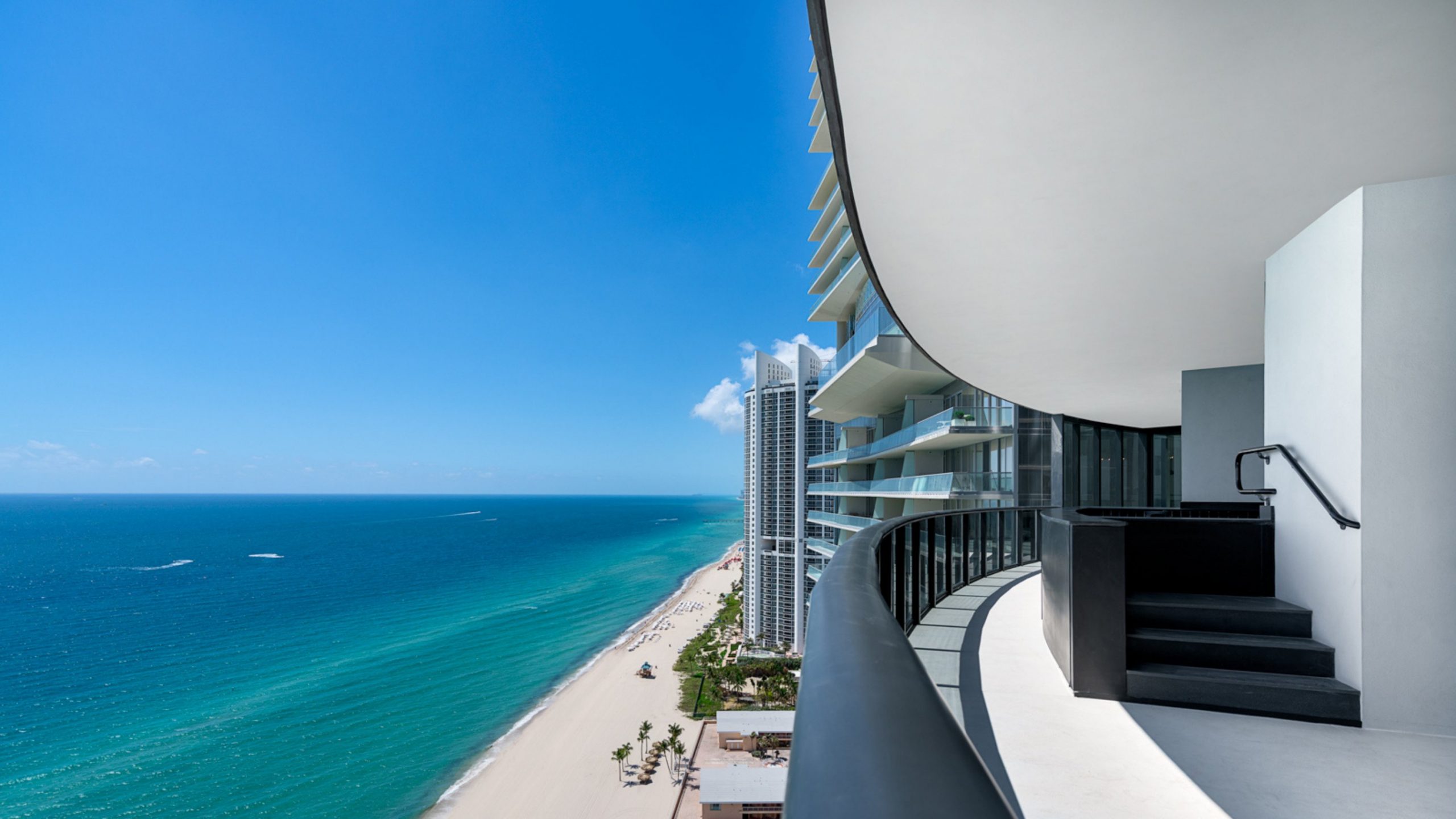 under_700kb_balcony_beach - Haute Residence by Haute Living