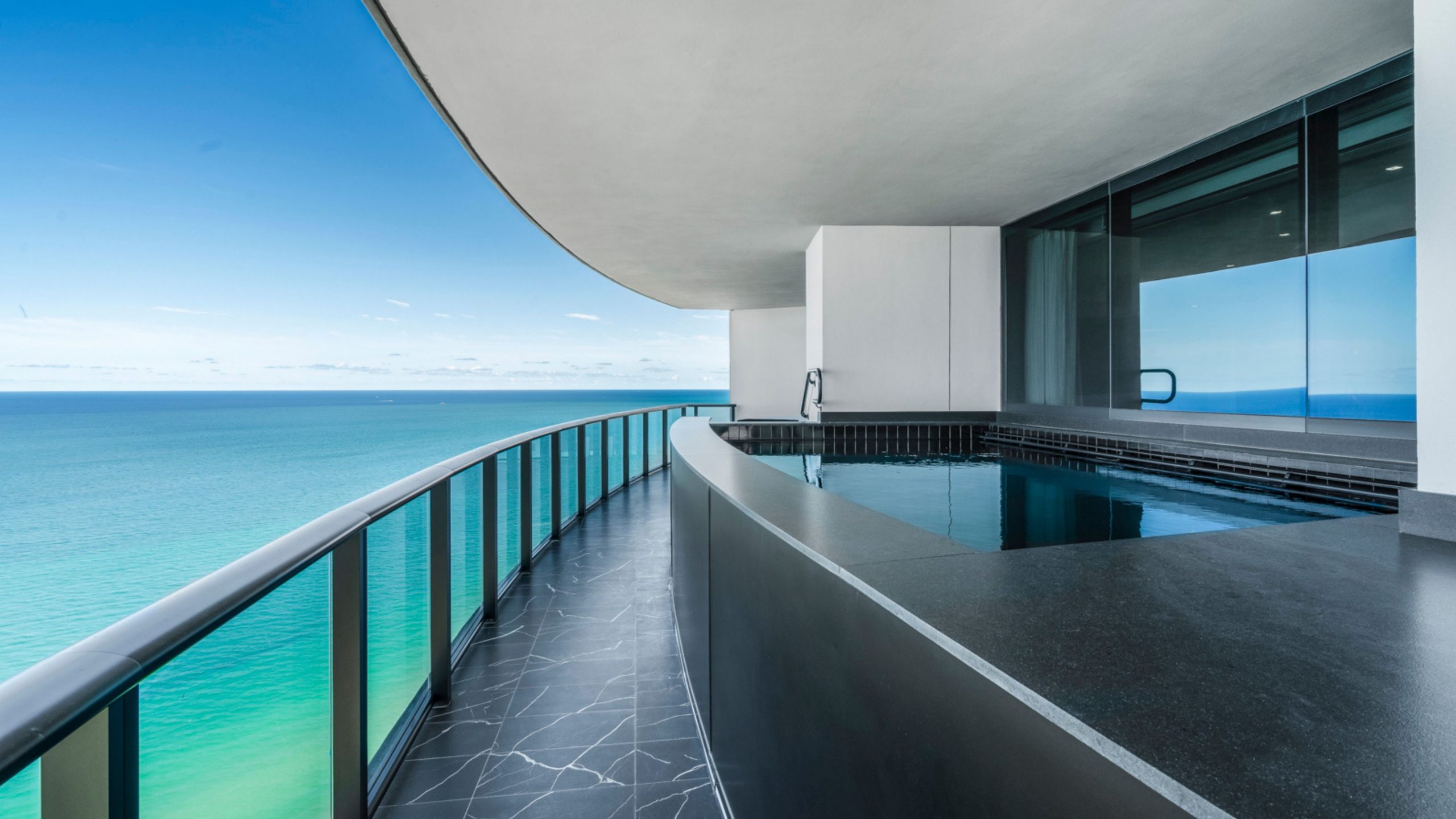 under_700kb_balcony_pool - Haute Residence by Haute Living