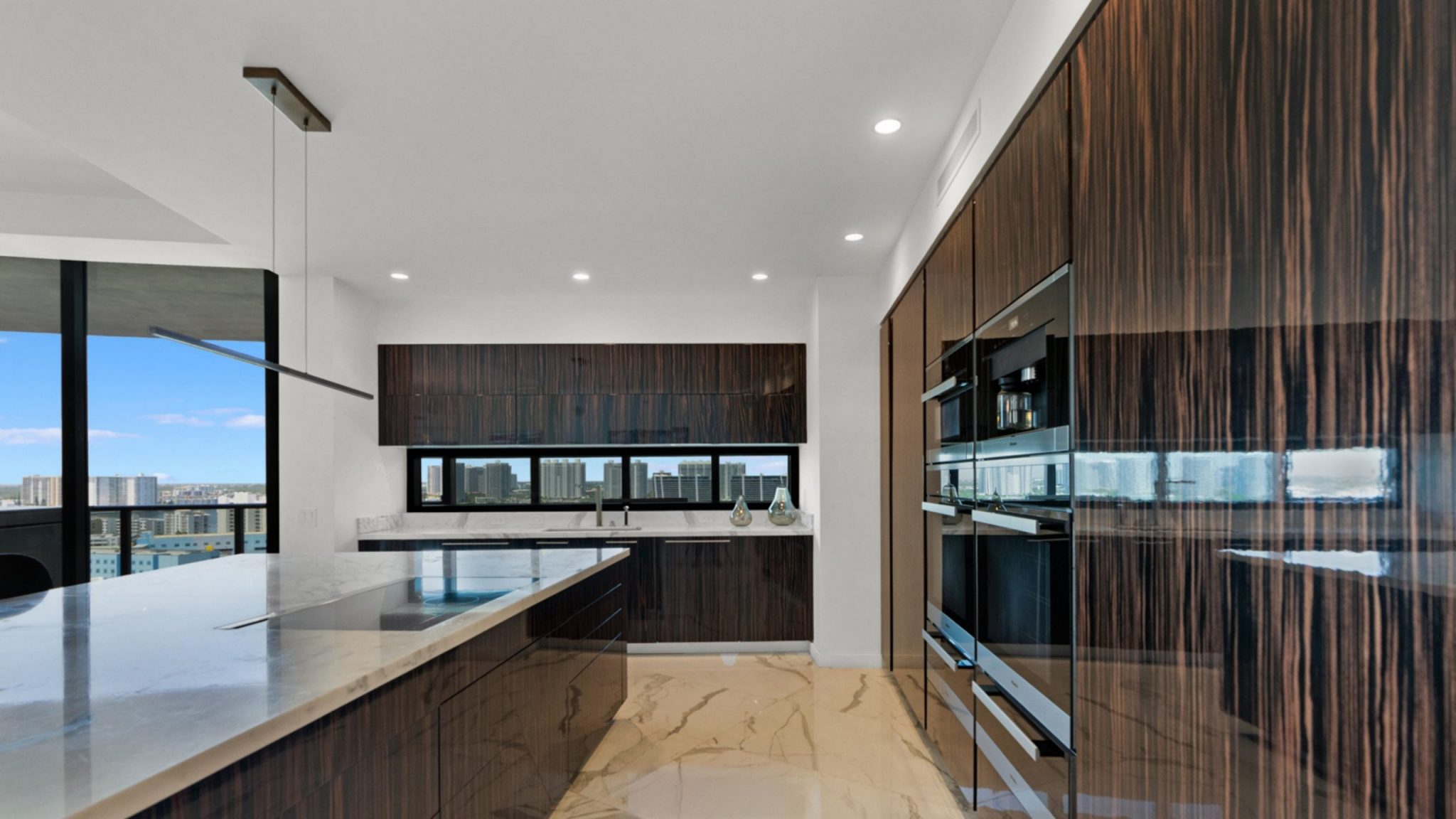 under_700kb_kitchen_dark_wood - Haute Residence by Haute Living